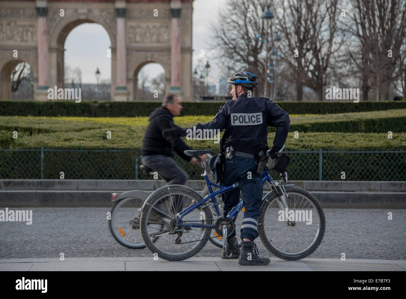 Paris policeman on bicycle Stock Photo - Alamy