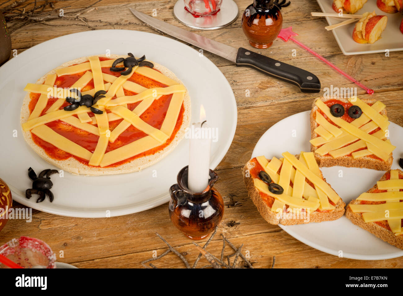 Halloween party table with assorted spooky snacks Stock Photo - Alamy