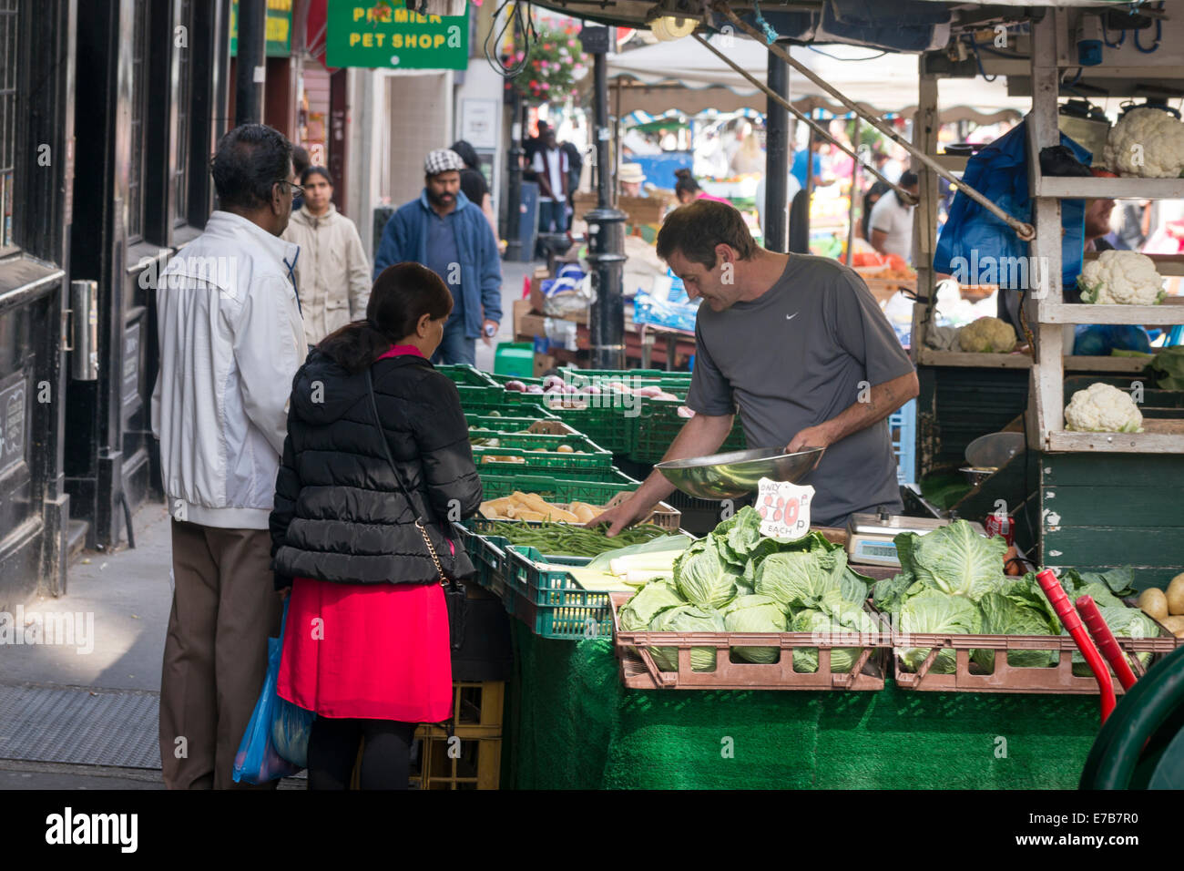 Market stall with customers Stock Photo - Alamy