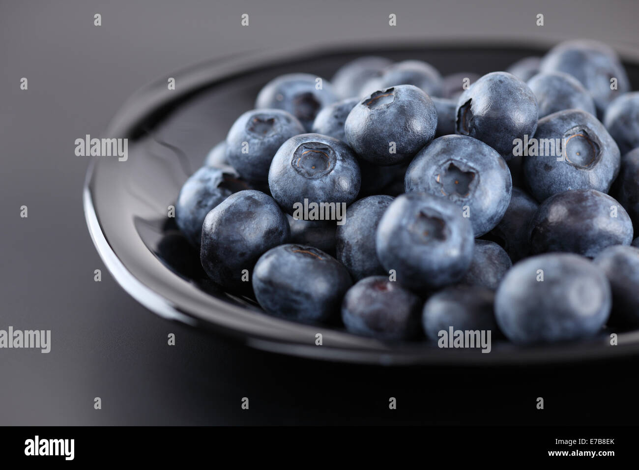 Blueberries in blue plate hi-res stock photography and images - Alamy