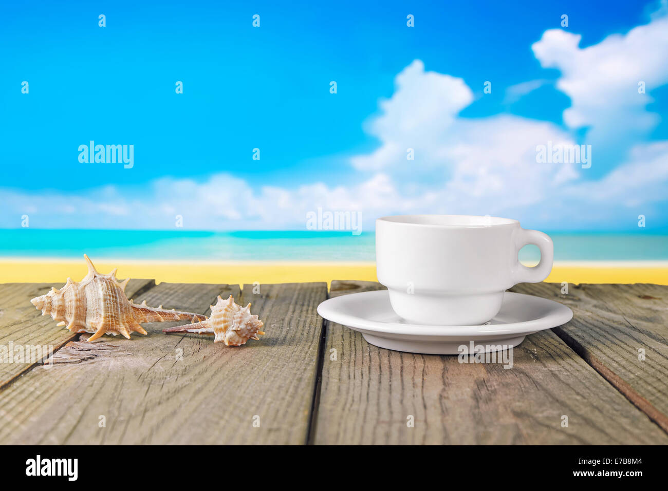 close up of white coffee cup on wooden table with landscape Stock Photo ...