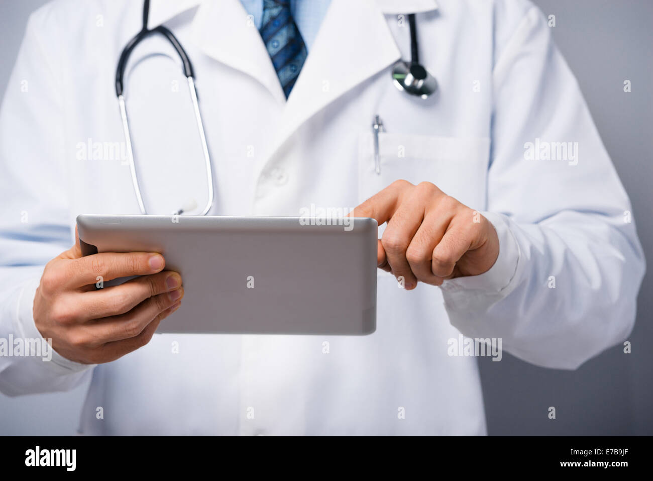 Male doctor with tablet computer Stock Photo - Alamy