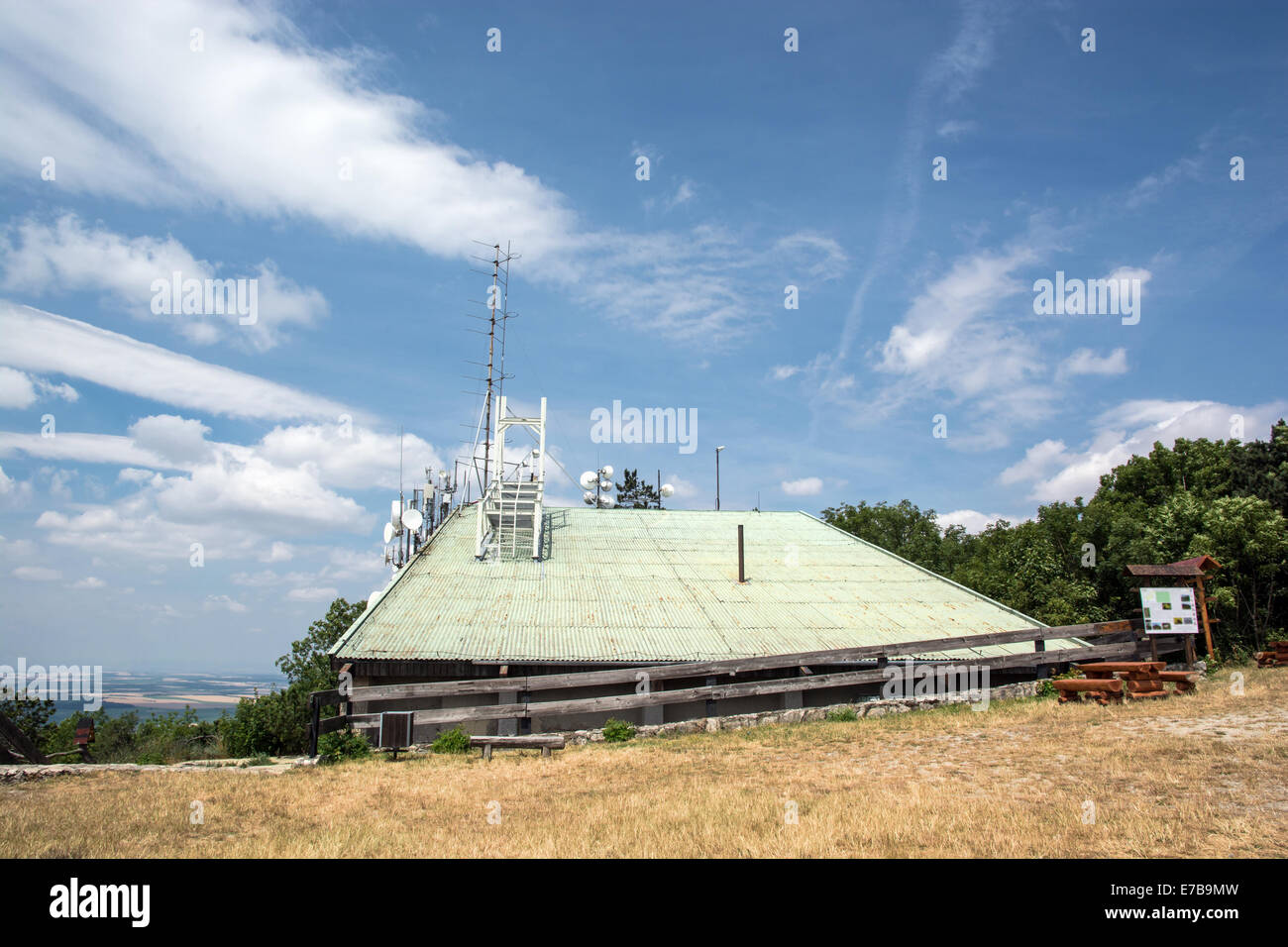 Roof with telecommunications antennas and cloudy sky Stock Photo - Alamy