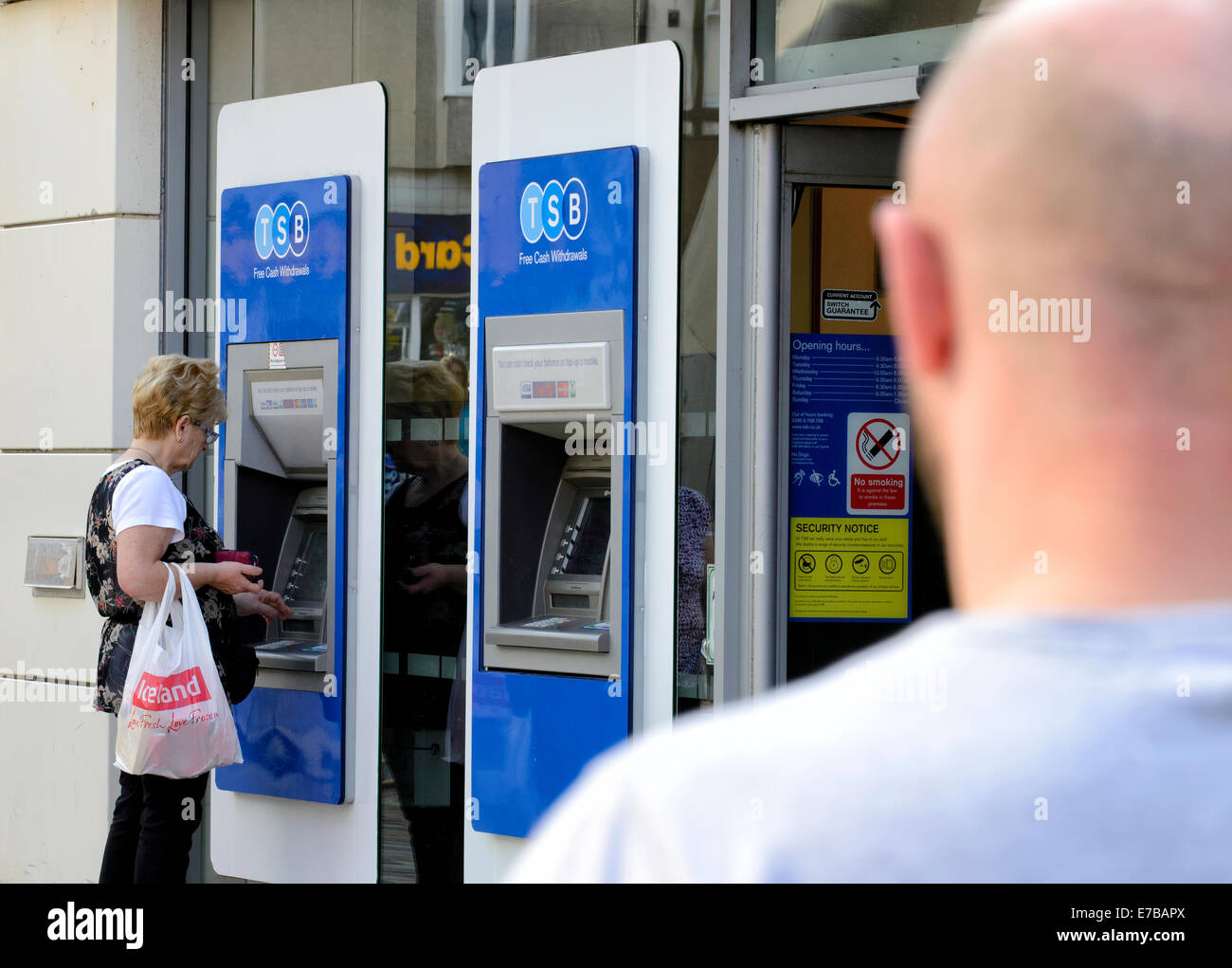 Using the cash machine hi-res stock photography and images - Alamy