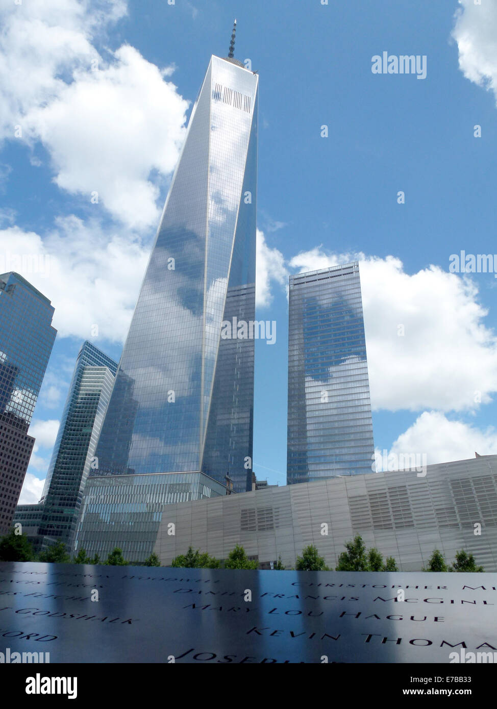 Clouds mirror on the glass facade of the One World Trade Center (1st ...