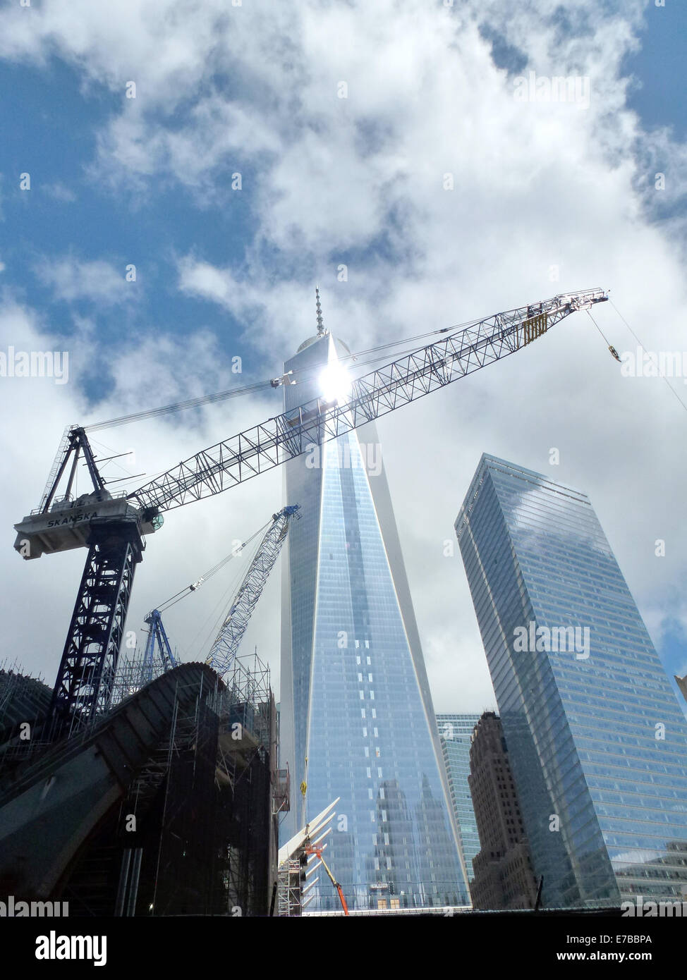 New York, USA. 26th June, 2014. Clouds mirror on the glass facade of ...