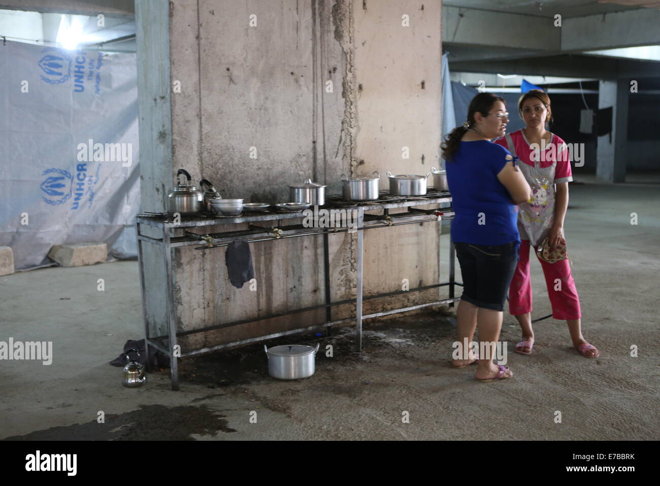 Erbil, Iraq. 11th Sep, 2014. People in one of the refugee camps for ...