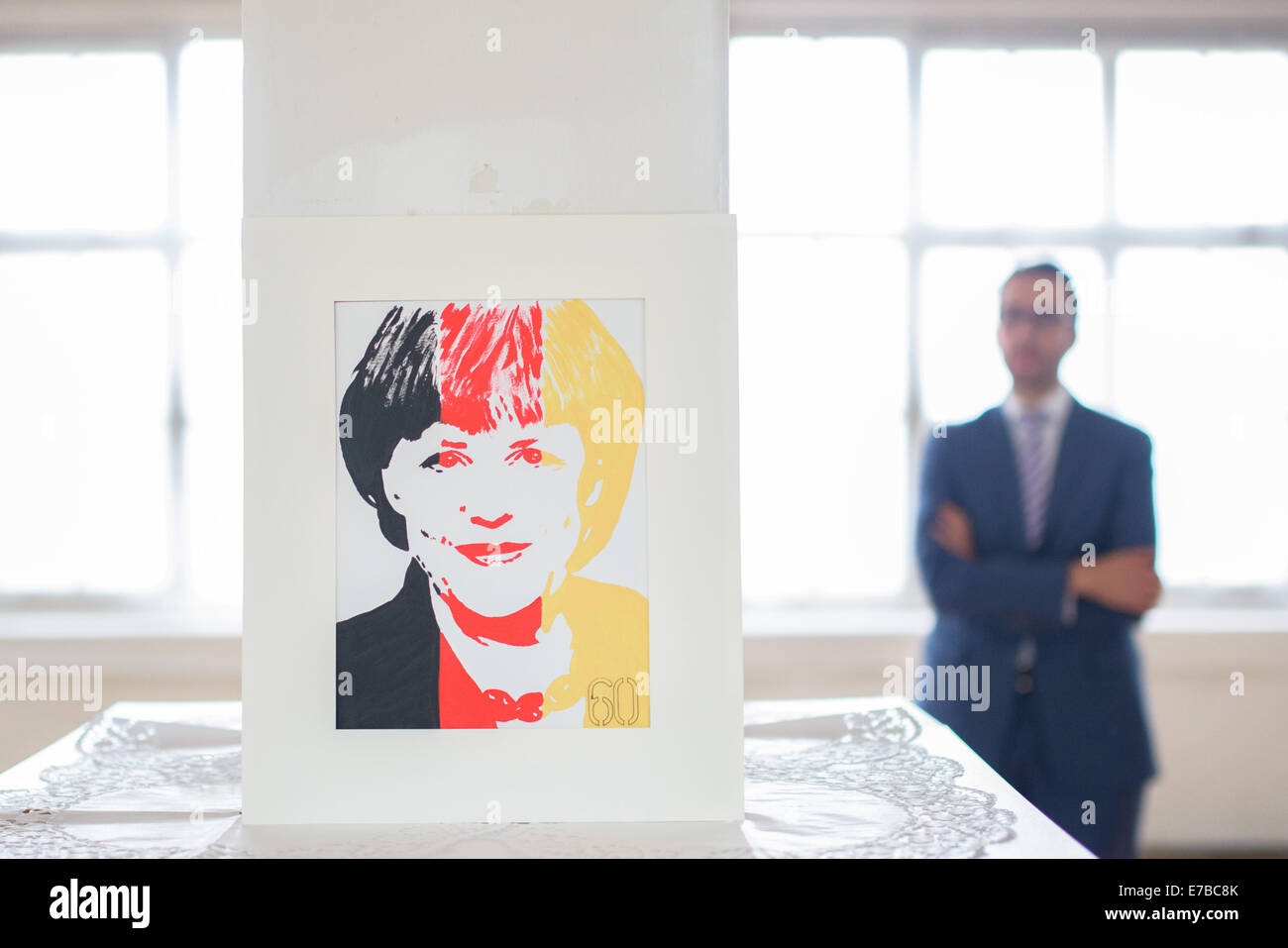 Apolda, Germany. 12th Sep, 2014. A visitor looks at a portrait of ...