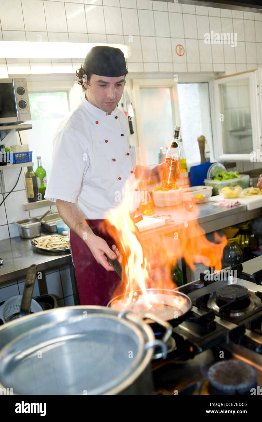 Flambé cooking in a kitchen, Italian restaurant, Upper Bavaria, Bavaria ...