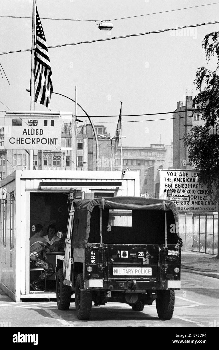 the Berlin Wall at the border crossing Checkpoint Charlie, in the ...