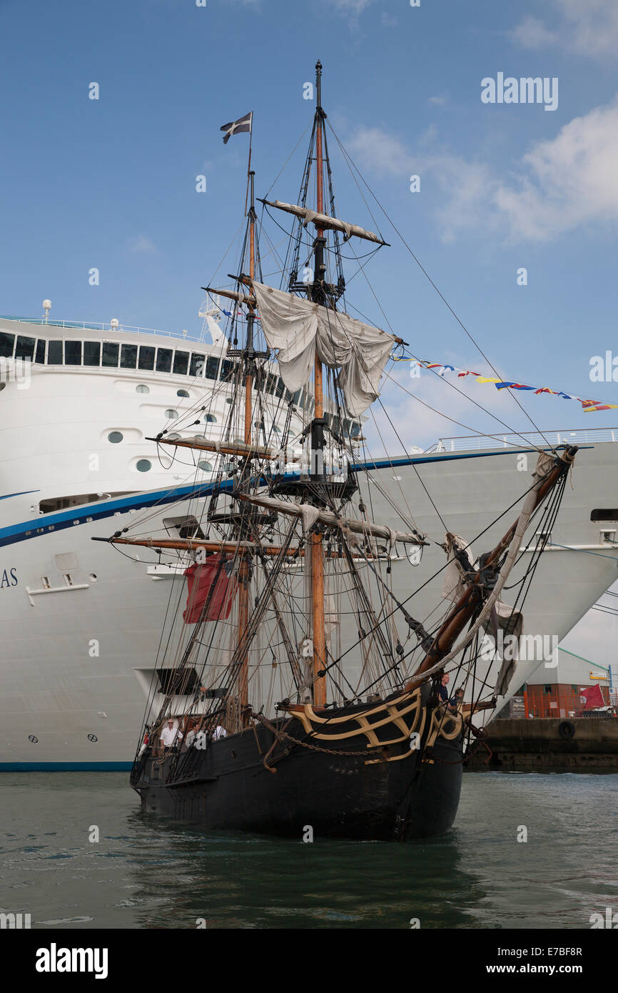 Tall ship Phoenix docks alonside the adventure of the seas cruise ship ...
