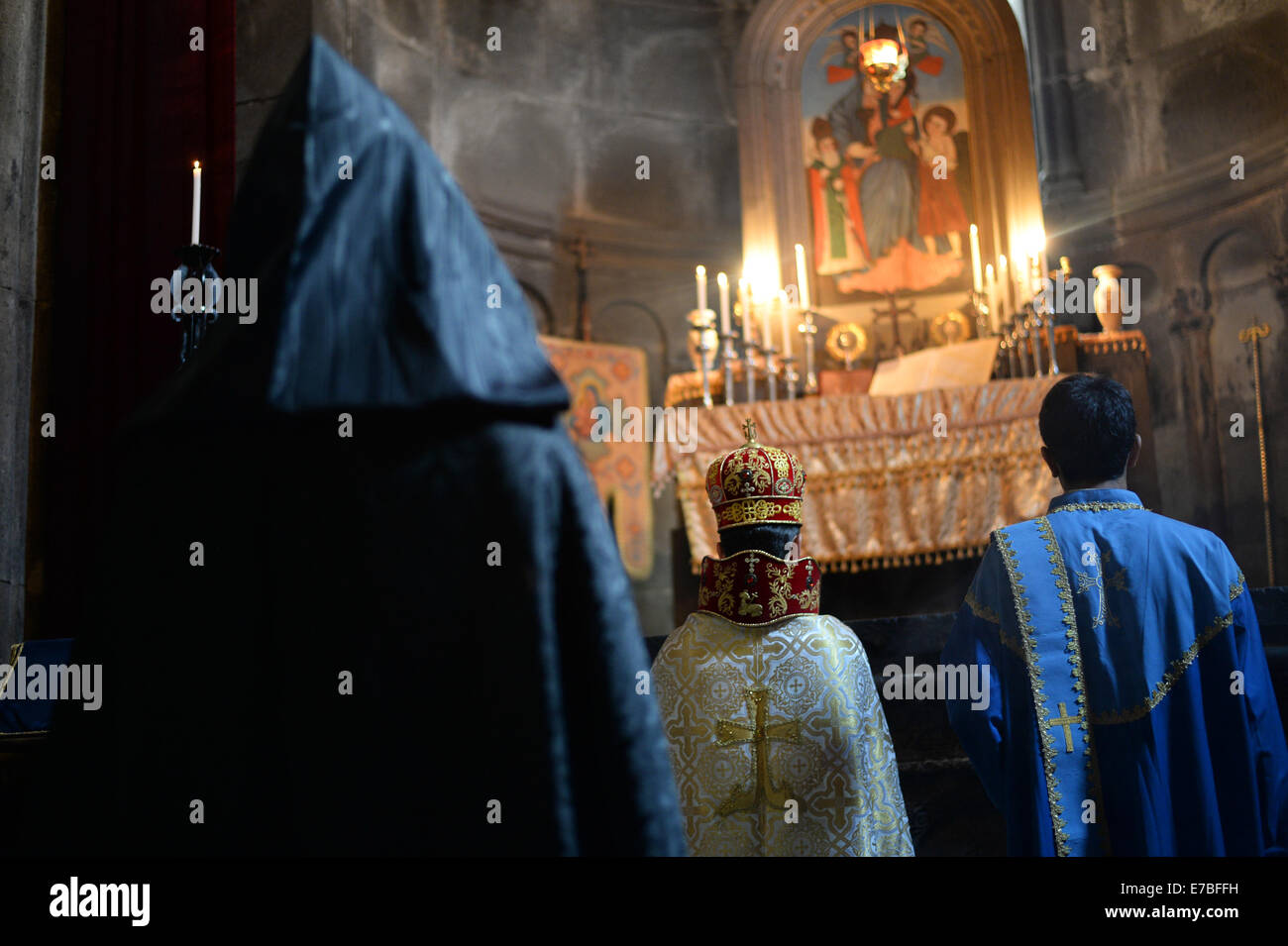 A monk, the pastor and a sexton wear religious habit during a church ...