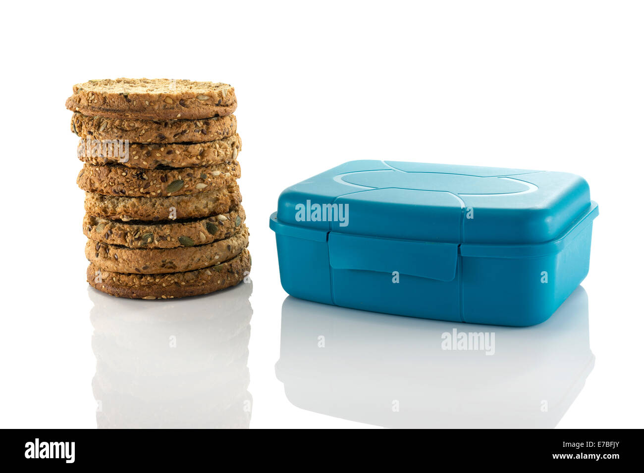 blue insulated lunch box and stack of rusks isolated on white Stock ...