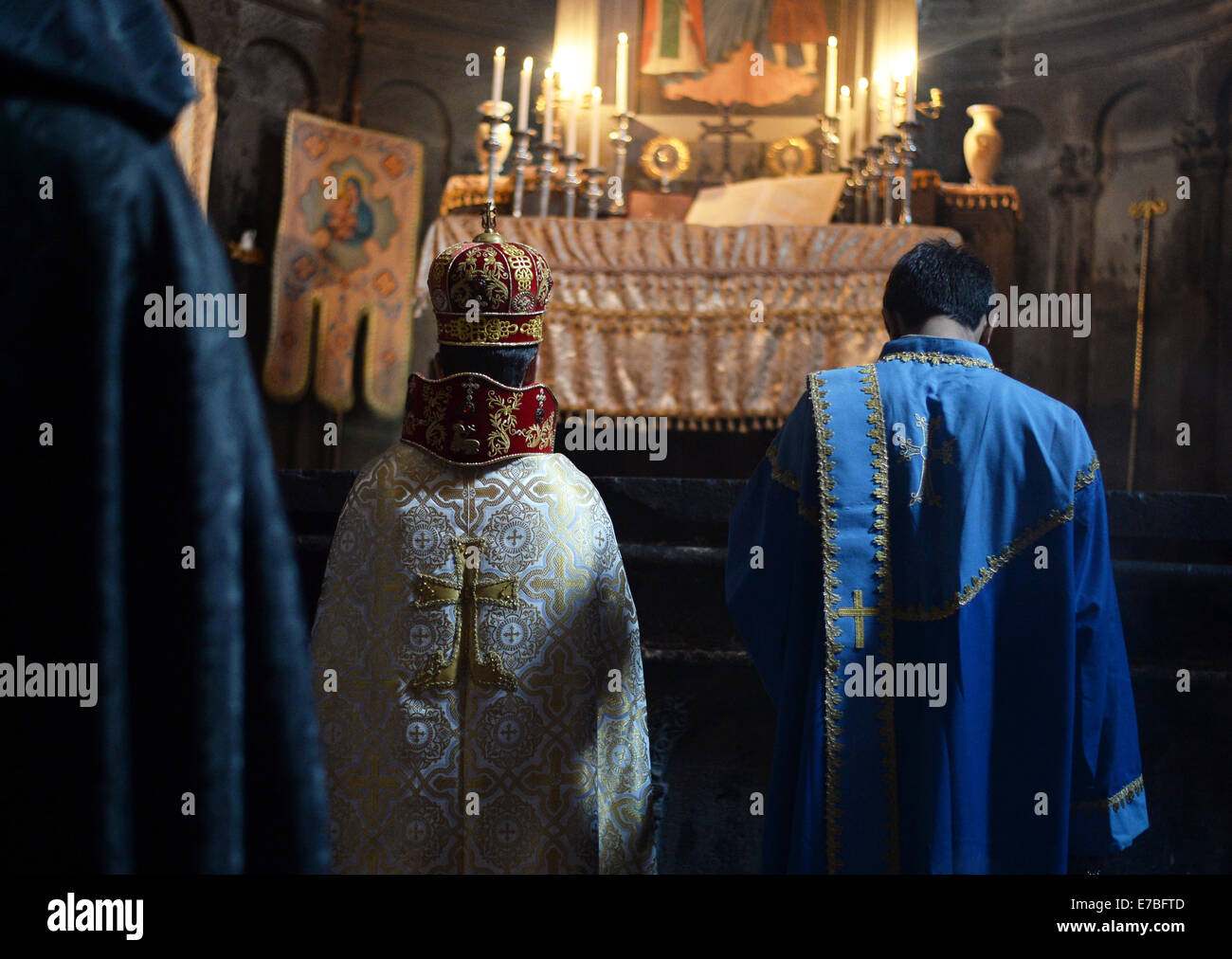 A monk, the pastor and a sexton wear religious habit during a church ...