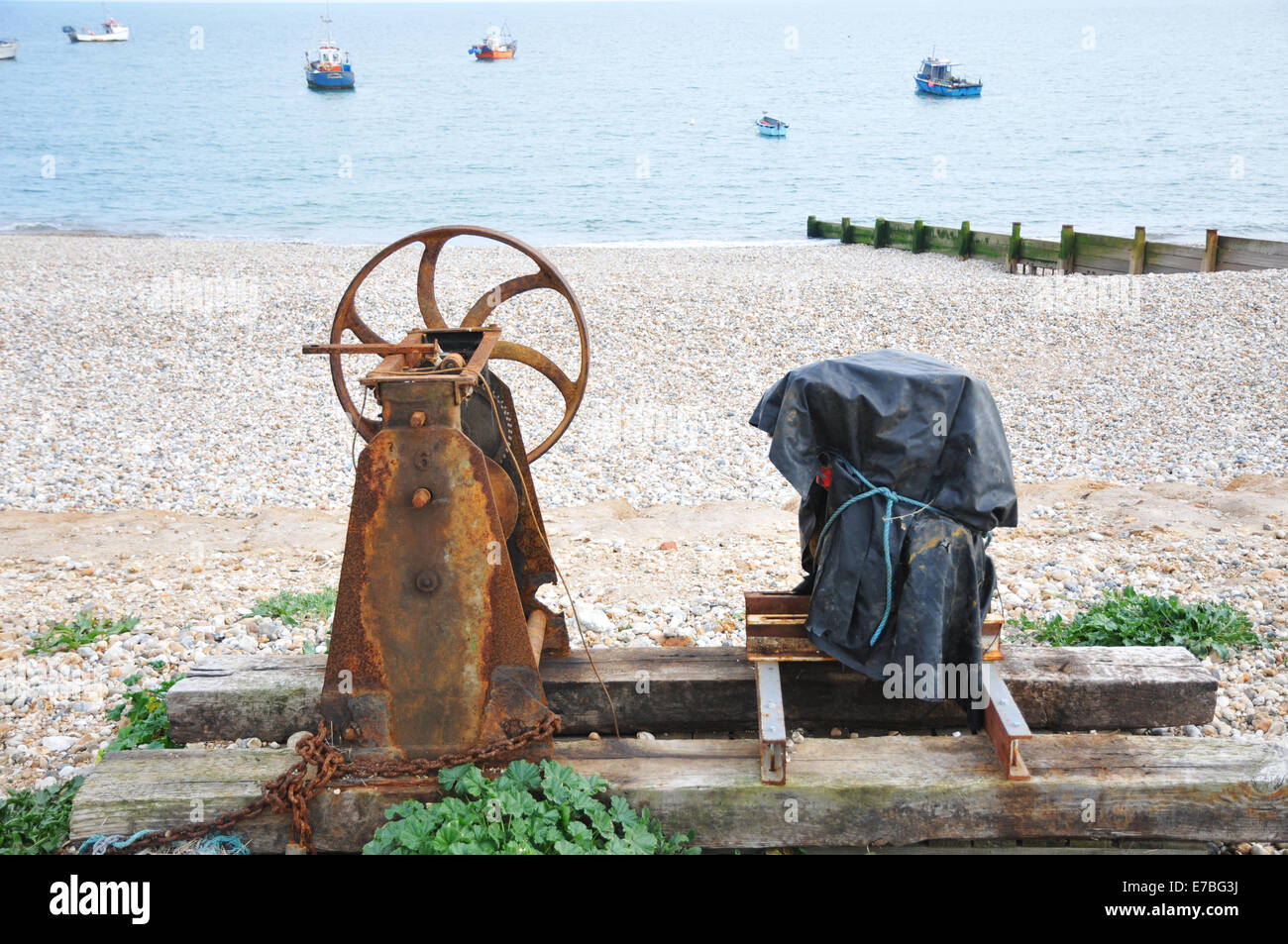 rusty winch overlooking beach Stock Photo - Alamy