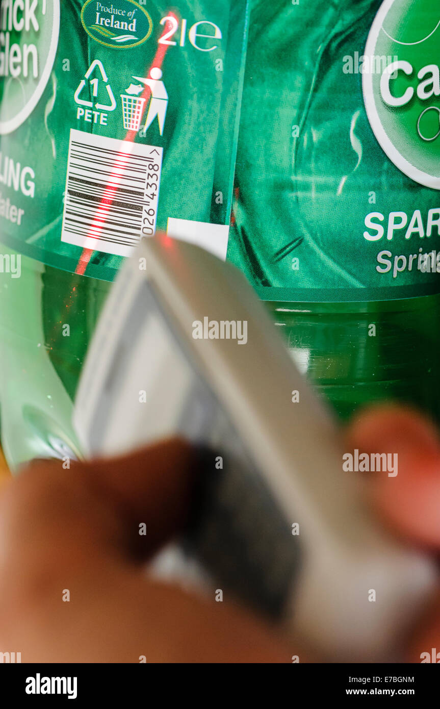 A man uses a handheld barcode scanner Stock Photo - Alamy