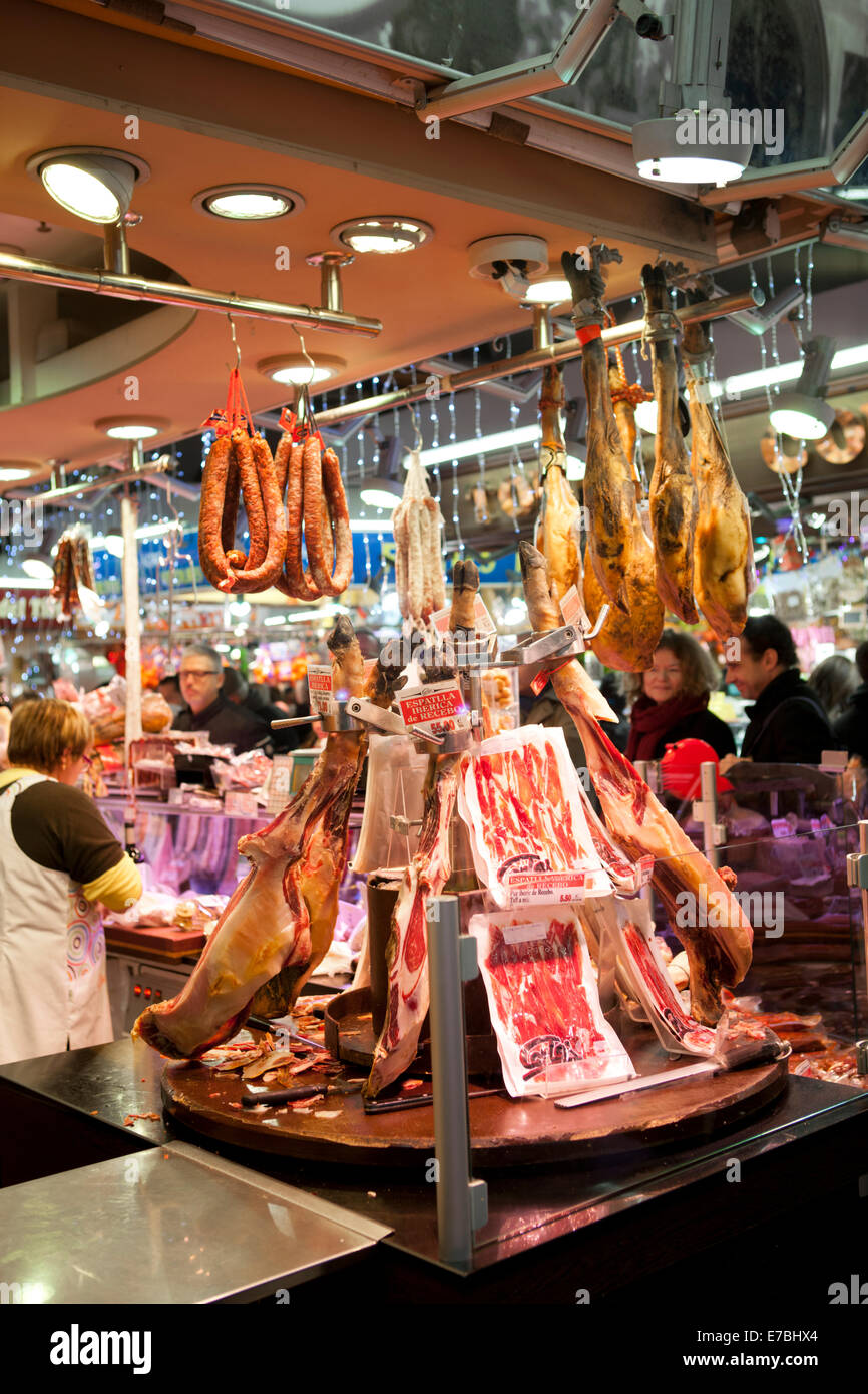 Spanish ham and pork products stall inside the Santa Caterina market in ...