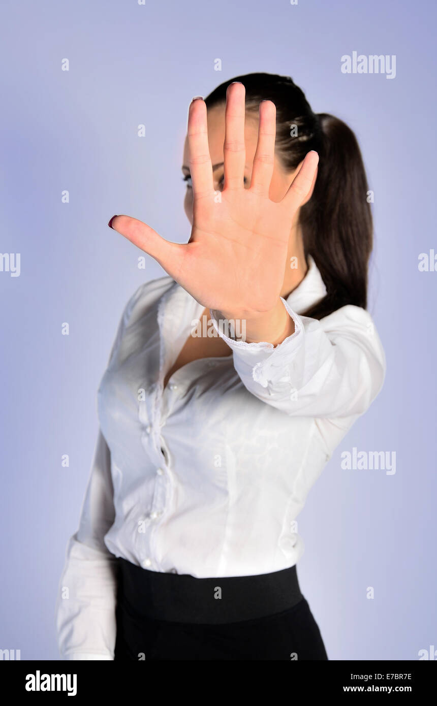 young woman refuse everything on blue background Stock Photo - Alamy