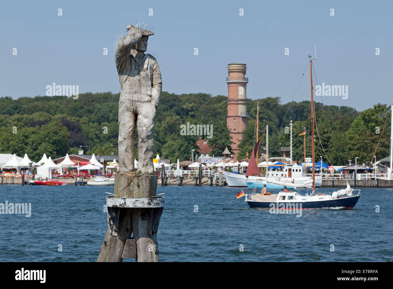 statue of Fiete and old lighthouse, Priwall, Travemuende, Schleswig ...