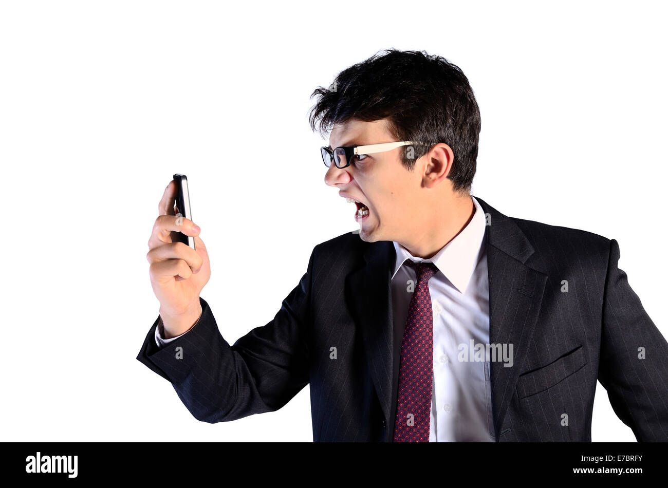 Young business man furious on white background Stock Photo - Alamy