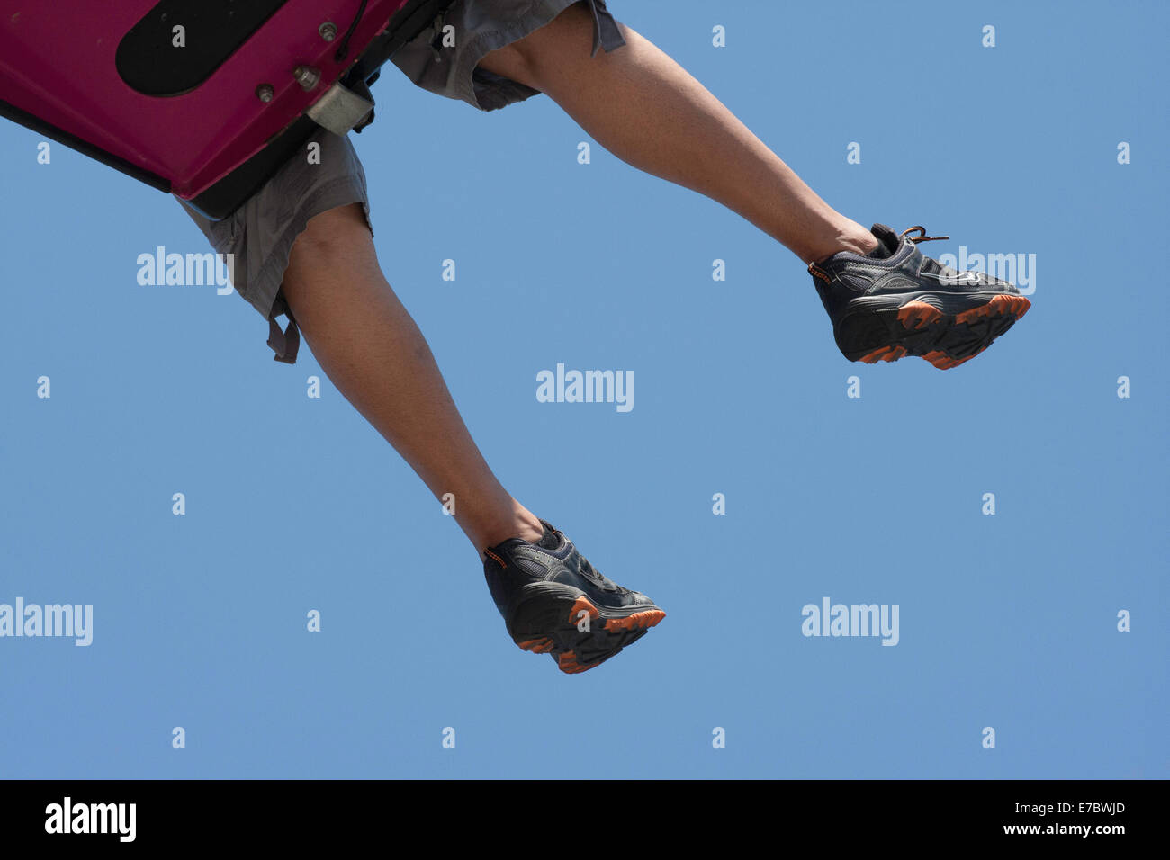 Legs dangling hi-res stock photography and images - Alamy