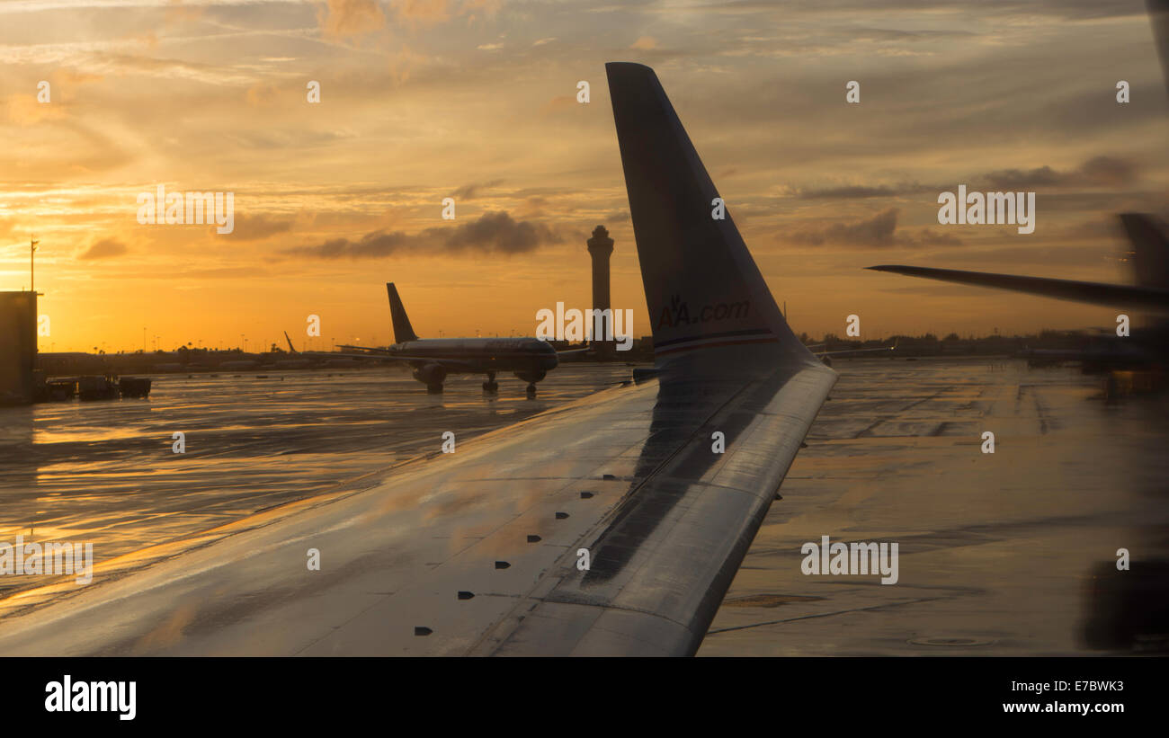 Airplane wing at sunset Stock Photo - Alamy