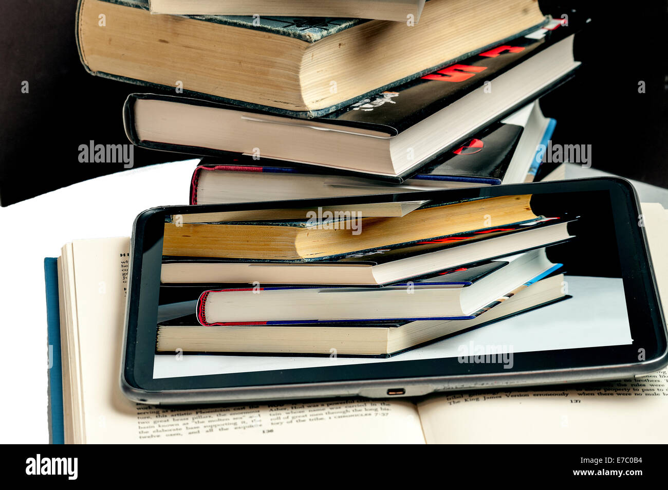 Books and a Tablet indicating the shift in technology Stock Photo - Alamy