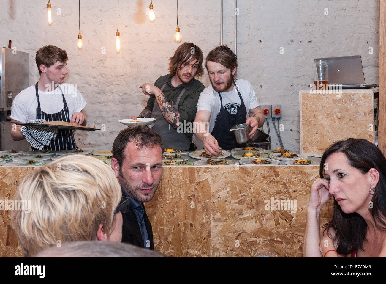 Brighton, UK. 12th Sep, 2014. Chefs Matt Stone [centre] and Doug ...