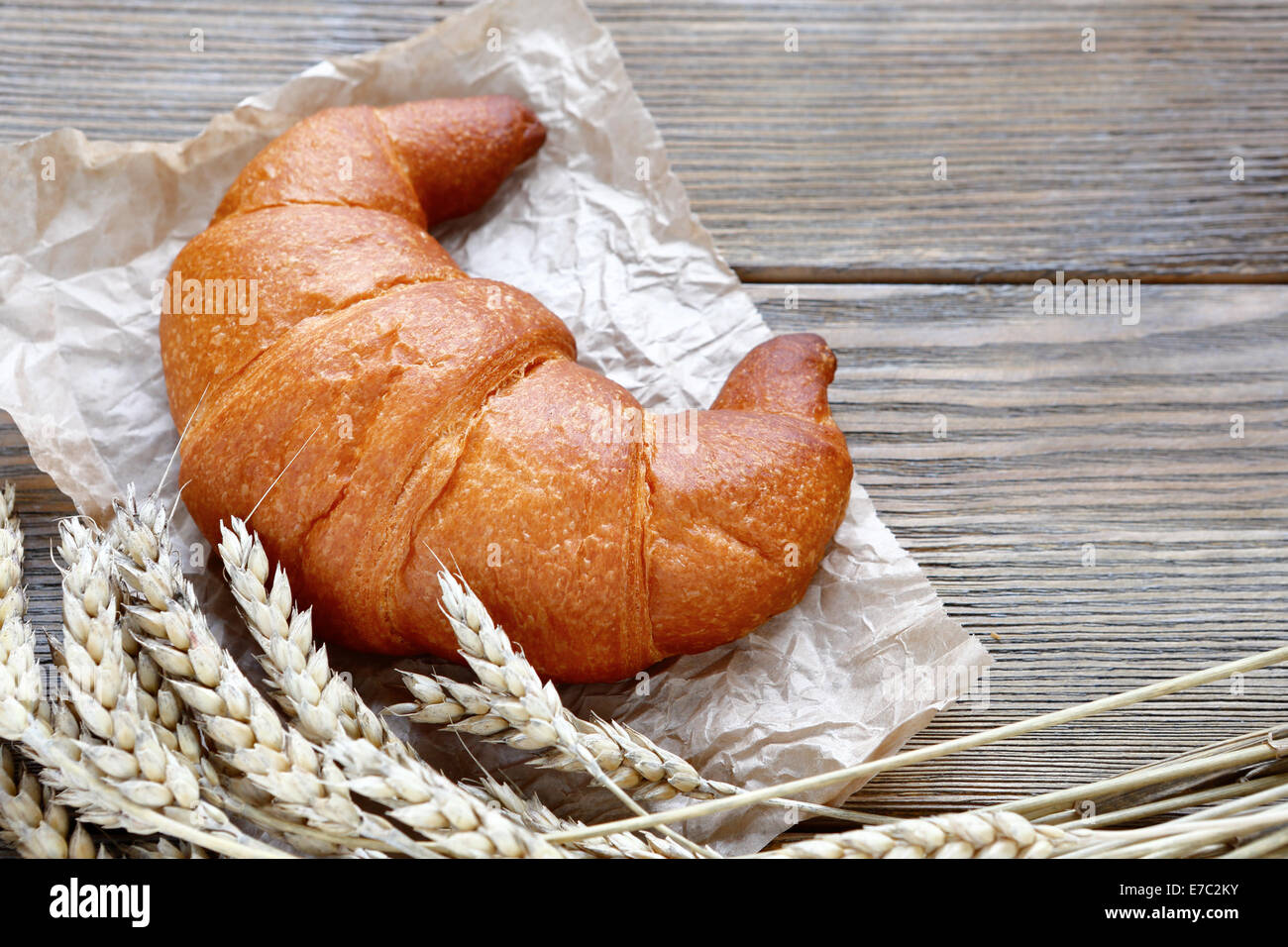 French croissant on paper, tasty food Stock Photo - Alamy