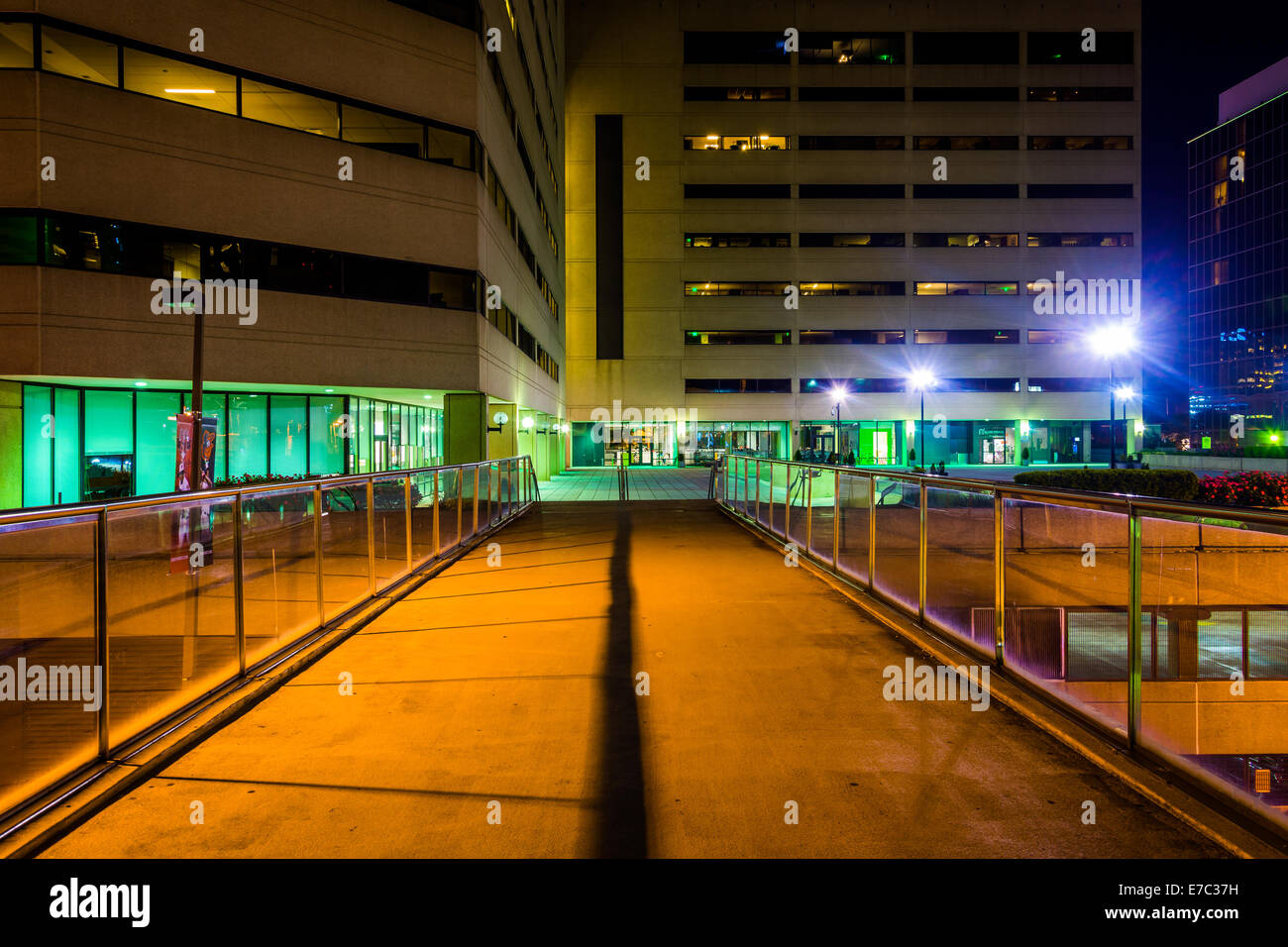 Elevated walkway and buildings at night in Baltimore, Maryland Stock ...