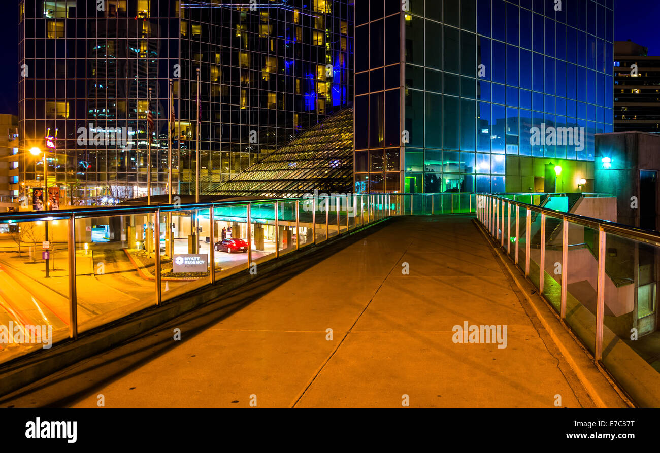 Elevated walkway and modern skyscrapers at night in Baltimore, Maryland ...