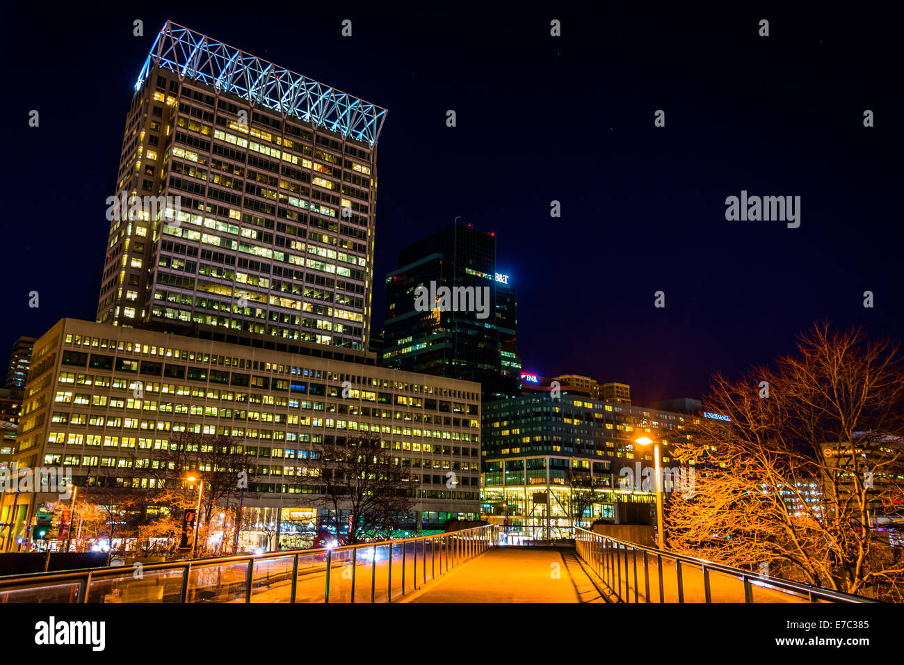 Elevated walkway and modern skyscrapers at night in Baltimore, Maryland ...