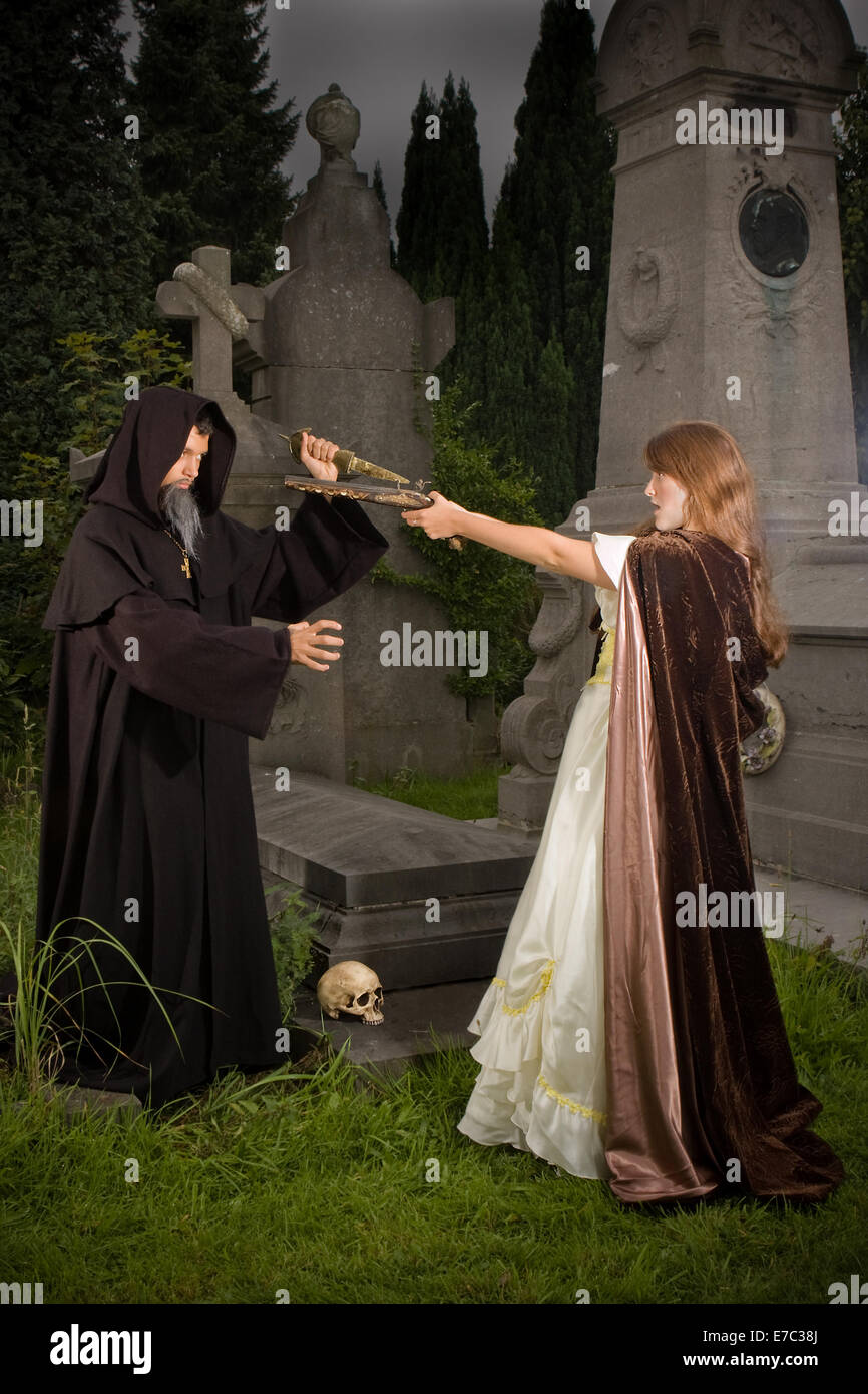 Priest holding gun hi-res stock photography and images - Alamy