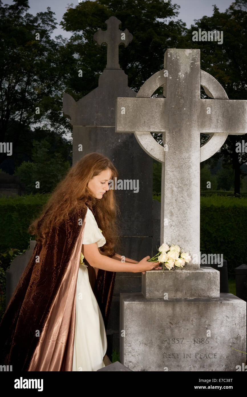Victorian scene of a mourning lady at a tombstone (text on tombstone ...