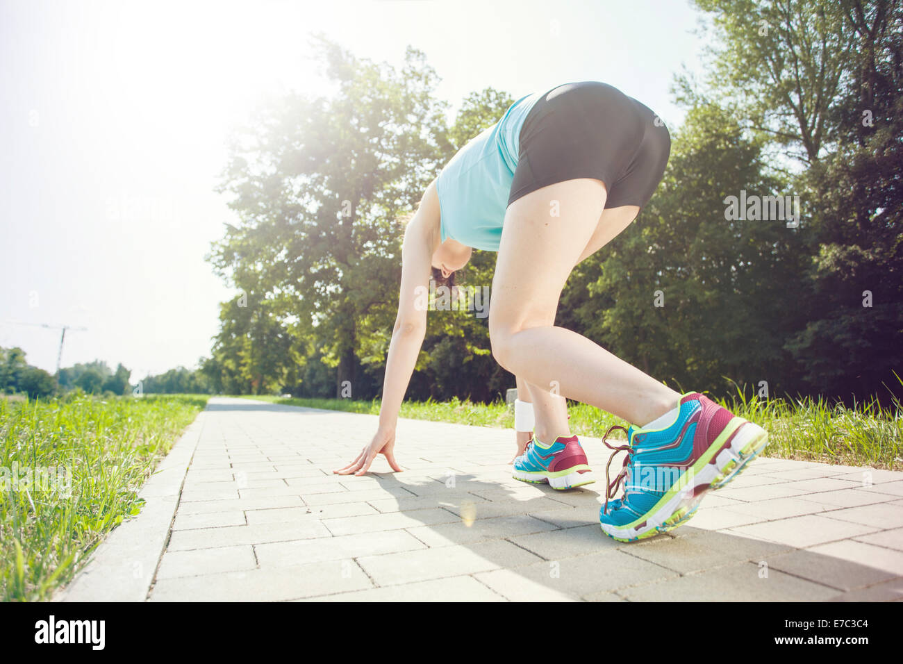 Sprinter start position on the track. Jogging sport Stock Photo - Alamy