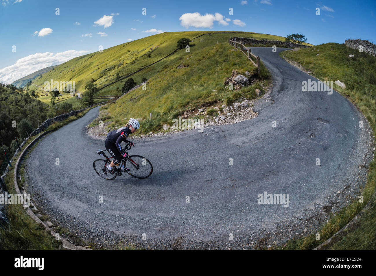 Rider climbing the famous Park Rash hairpin bend in Coverdale ...