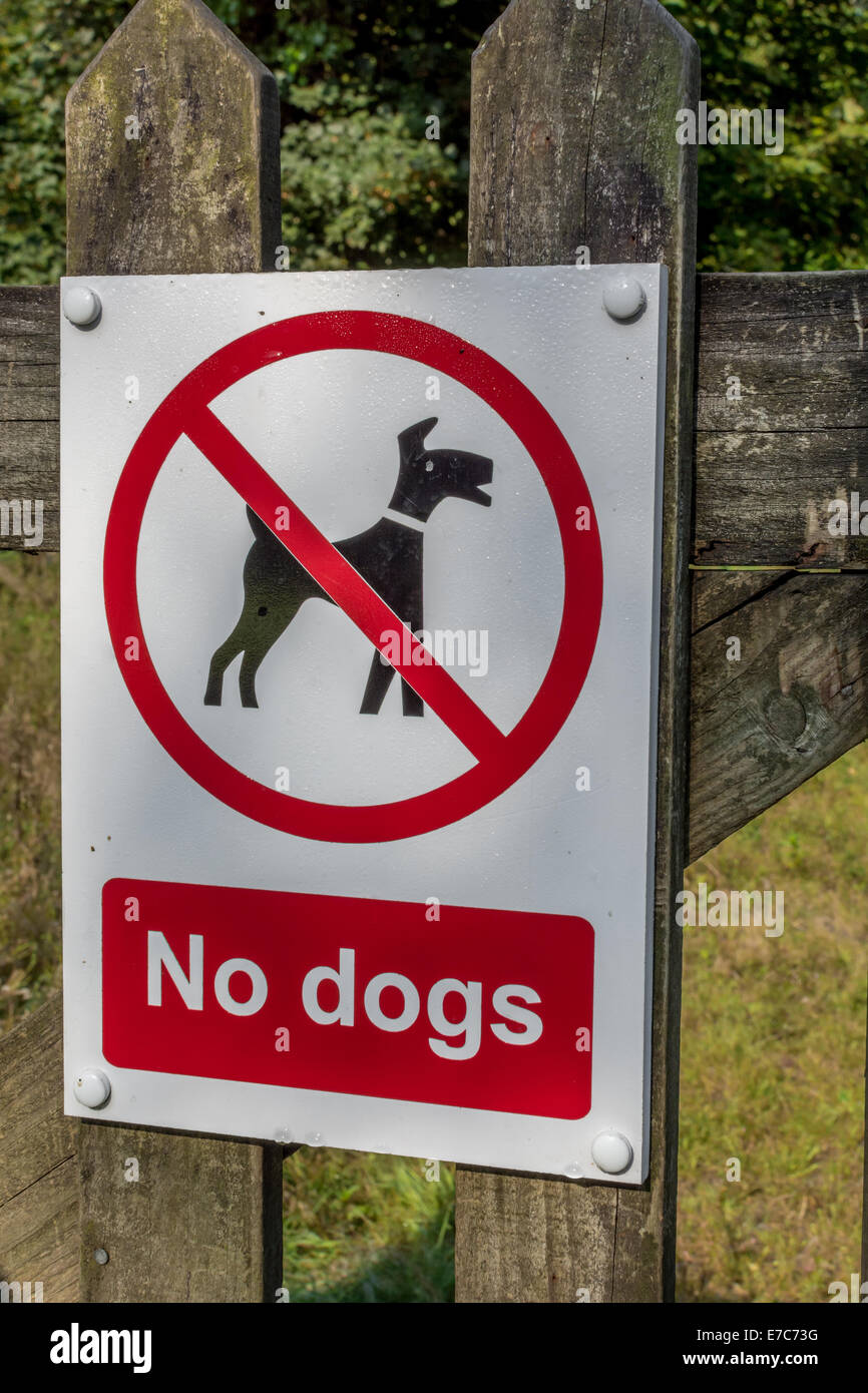 Sign warning dog owners to keep their pets away from public area. No ...