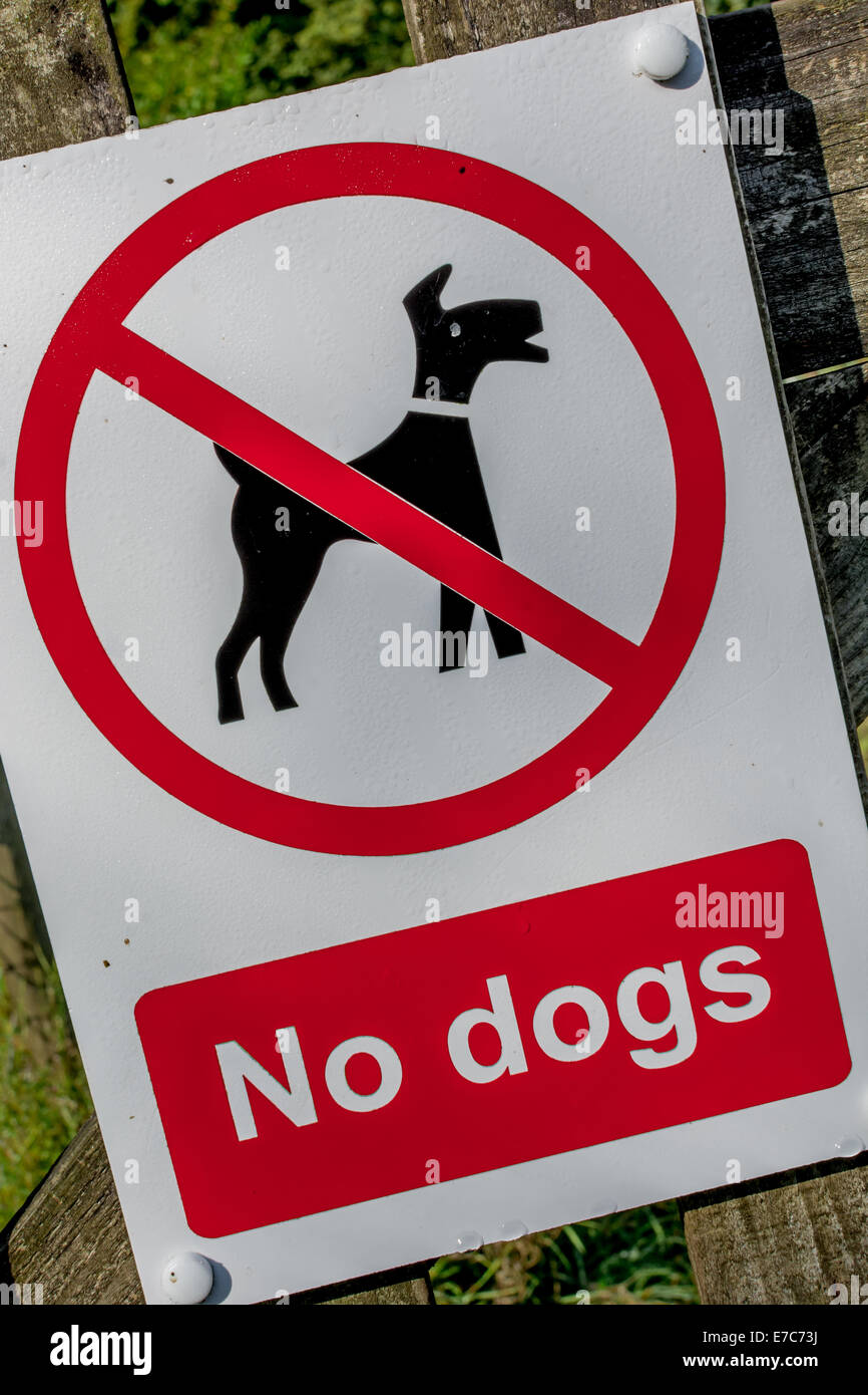 Sign warning dog owners to keep their pets away from public area. No ...