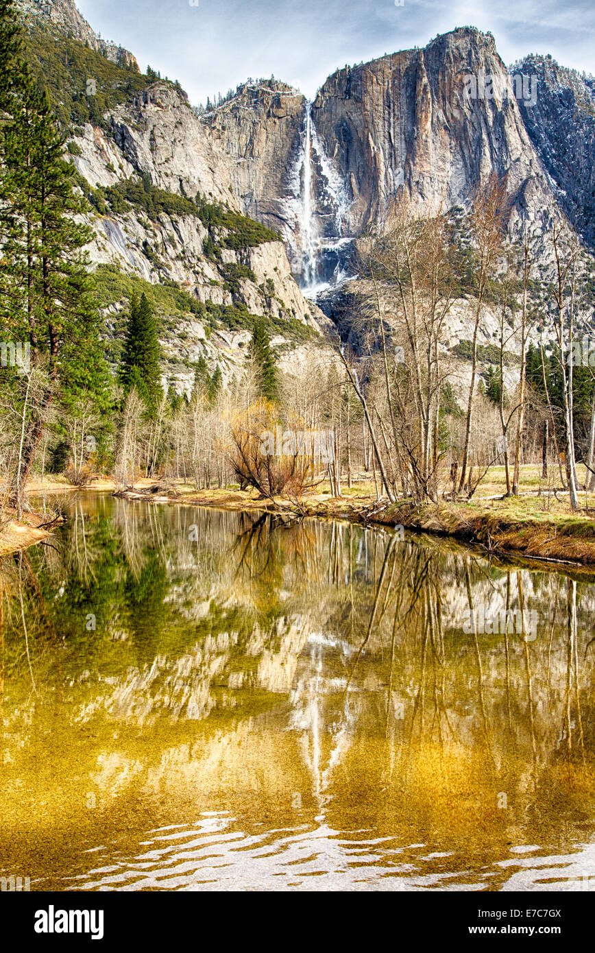 Yosemite Falls reflected in the Merced River. Yosemite National Park ...