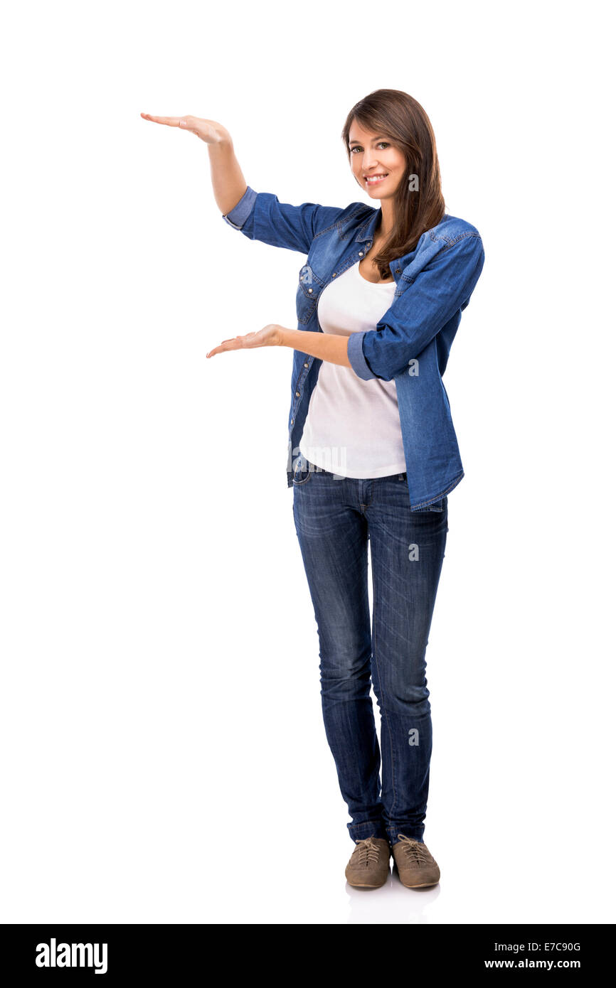 Beautiful woman showing something over a white background Stock Photo ...