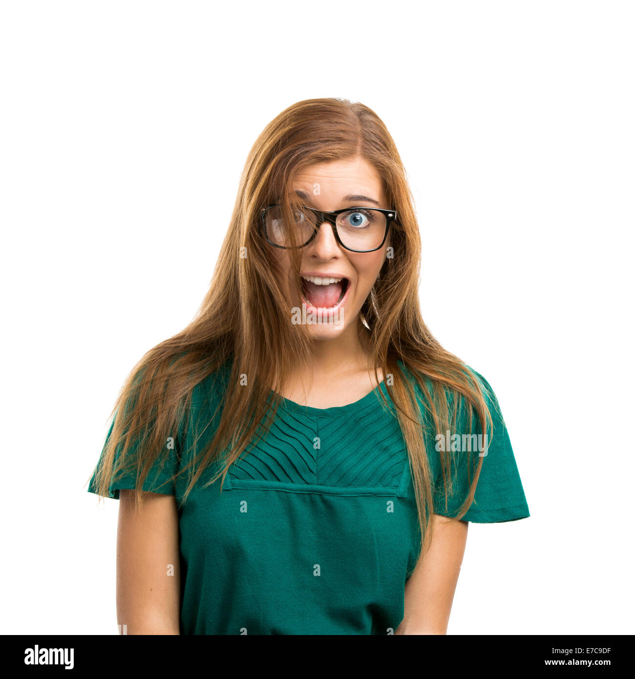 Portrait of a beautiful girl with a surprised expression isolated on ...