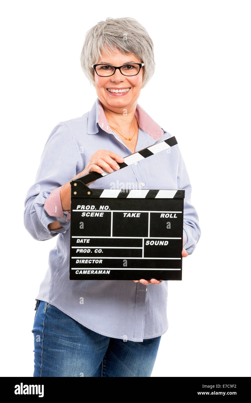 Happy elderly woman holding a clapboard, isolated on white background ...