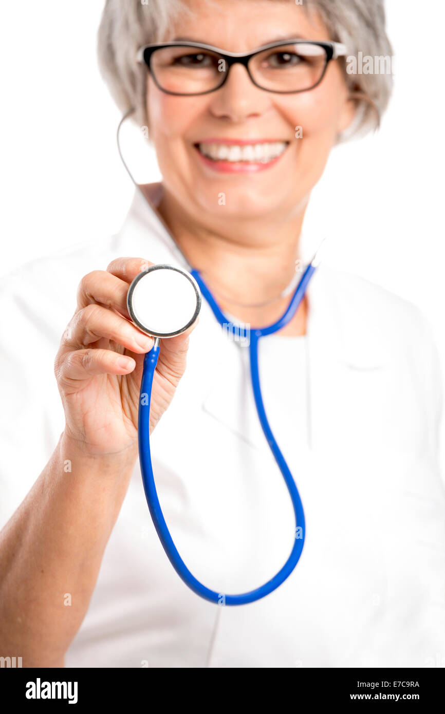 Happy old female doctor holding a stethoscope, isolated on white Stock ...