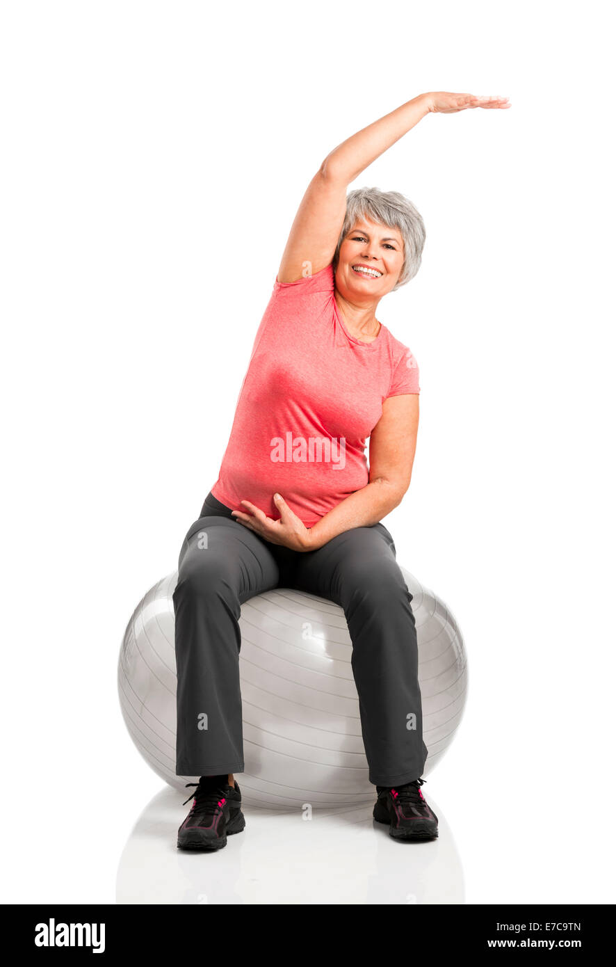 Happy fitness old woman making exercises with a PIlates ball Stock ...