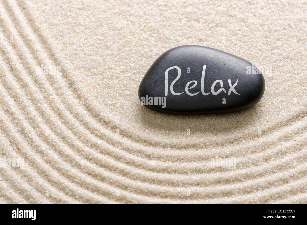 Black stone with the inscription Relax Stock Photo - Alamy