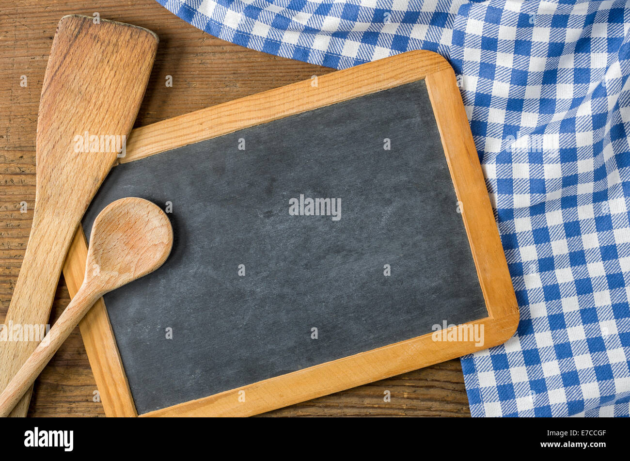 Chalkboard with wooden spoons on a blue checkered tablecloth Stock ...