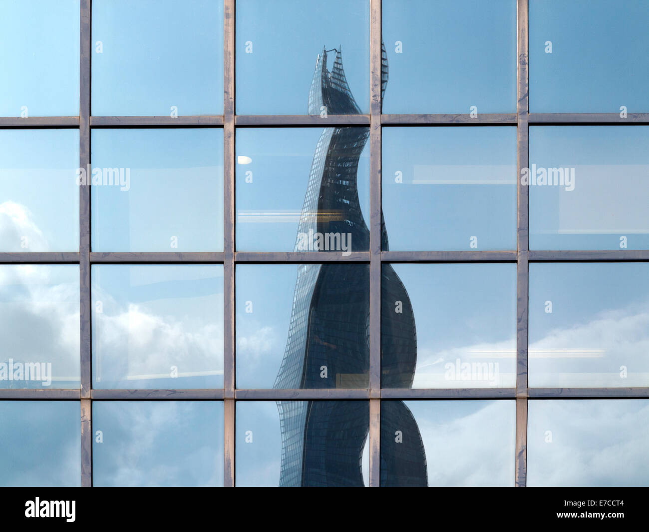 The Shard's distorted reflection in glass and steel framed windows ...