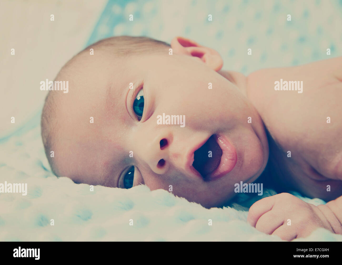 Newborn portrait of a 2 week old baby boy with his mouth open Stock ...