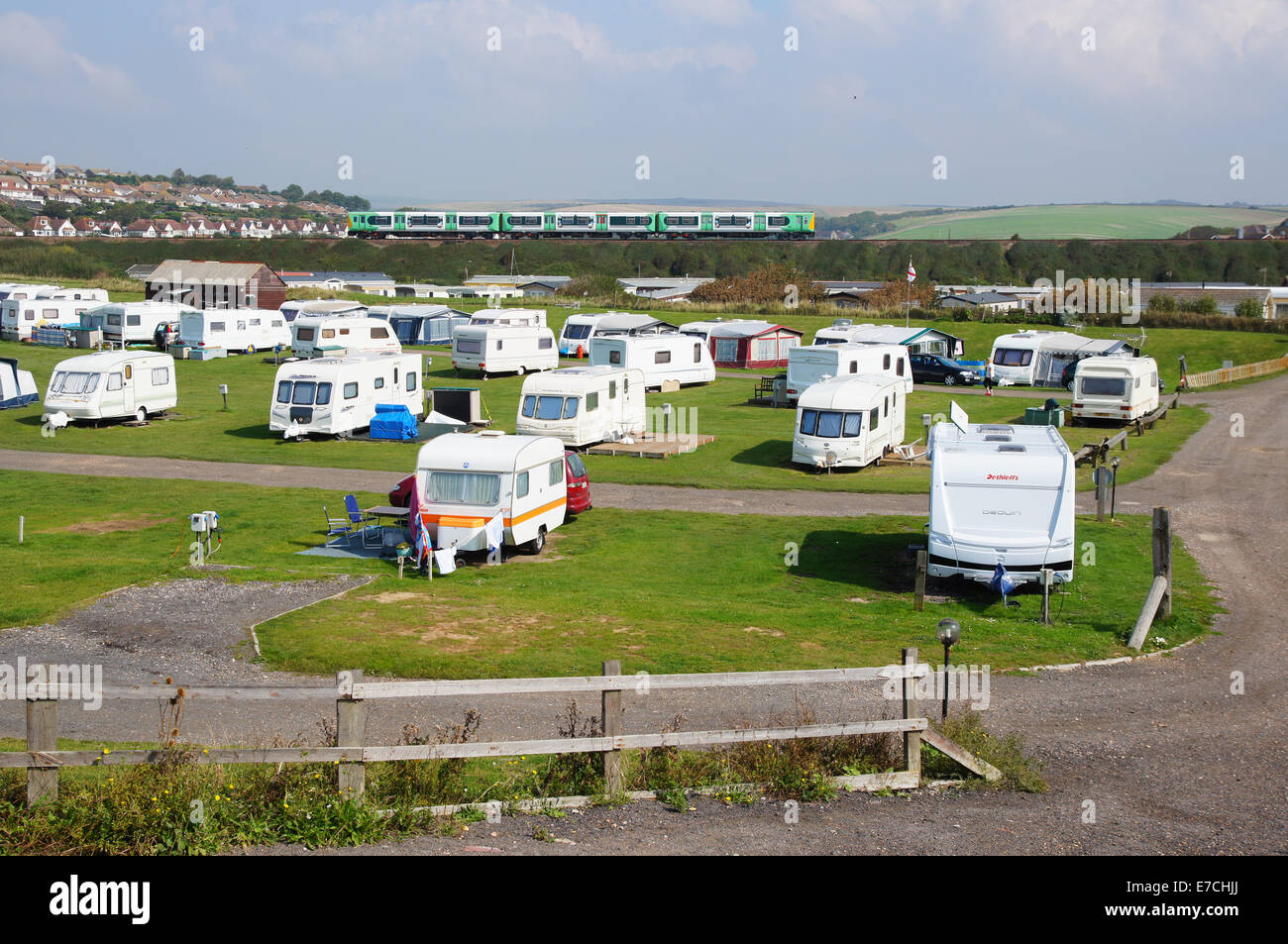 A caravan site, motorhomes caravans campers next to the beach at ...