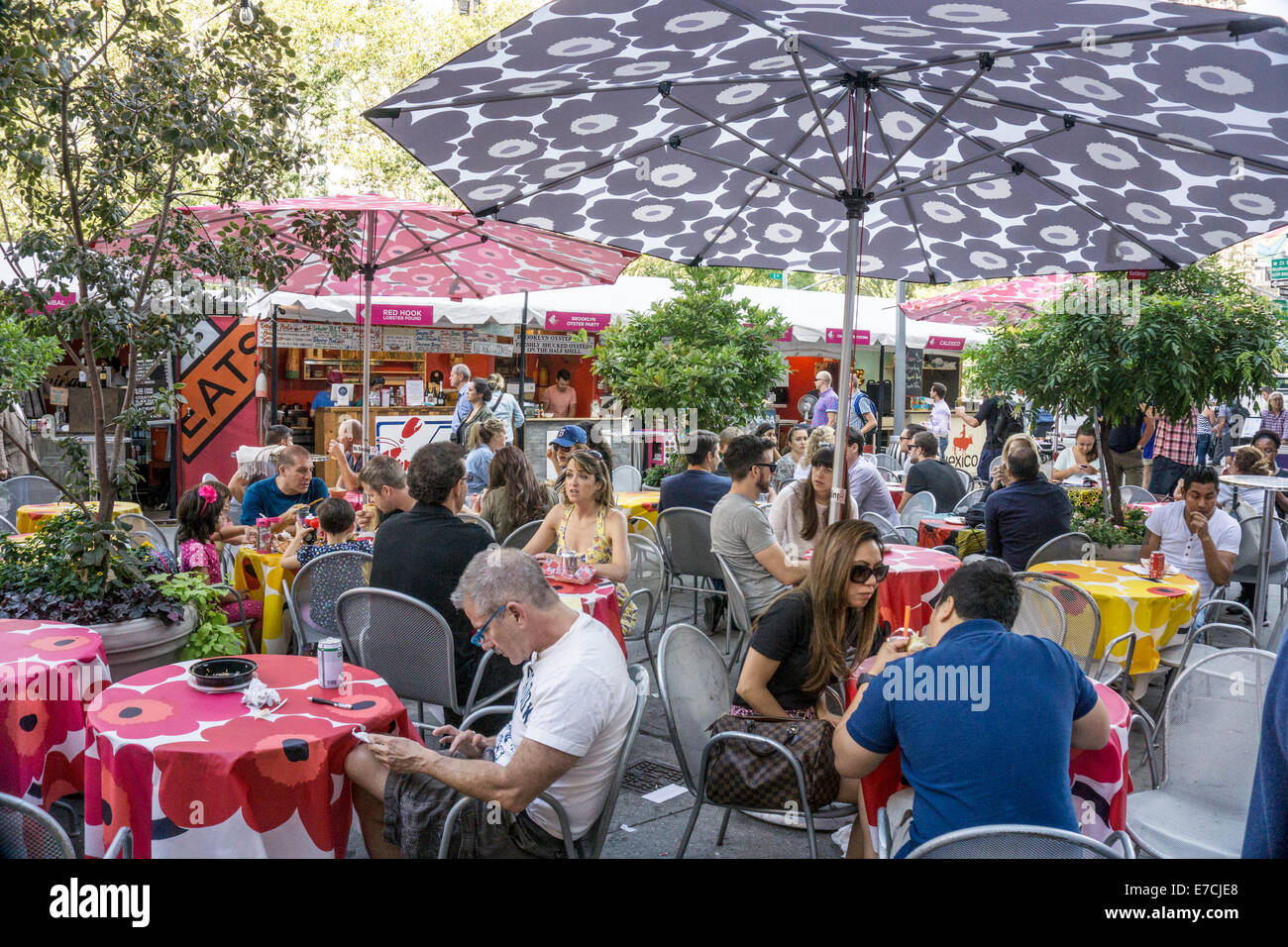crowd enjoys dining outside at Mad. Sq. Eats. pop up food court with ...